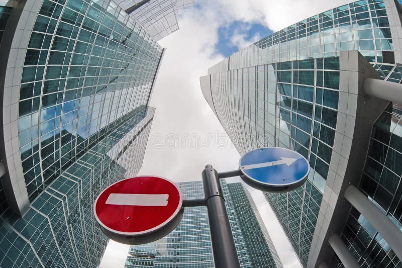 Road Signs on the Background of Office Buildings. Stock Image - Image ...