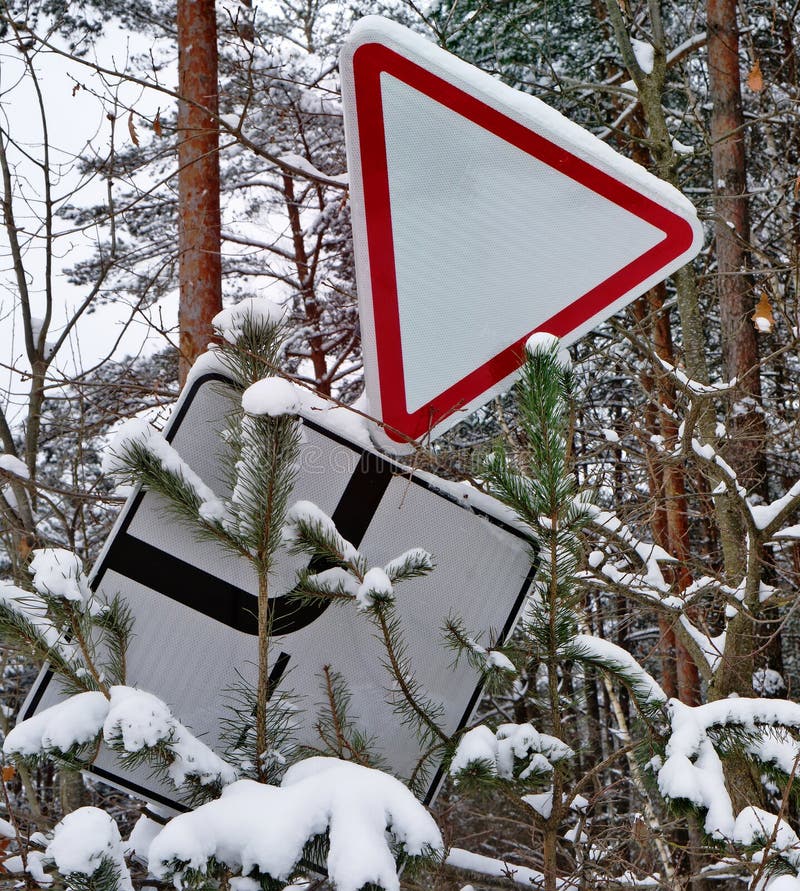 Road Signs Fall Under the Weight of Snow and Cold Stock Photo - Image ...