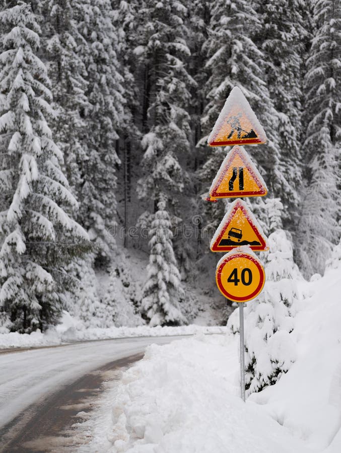 Road Signs. Mountain Road in Forest during a Snowfall Stock Image ...