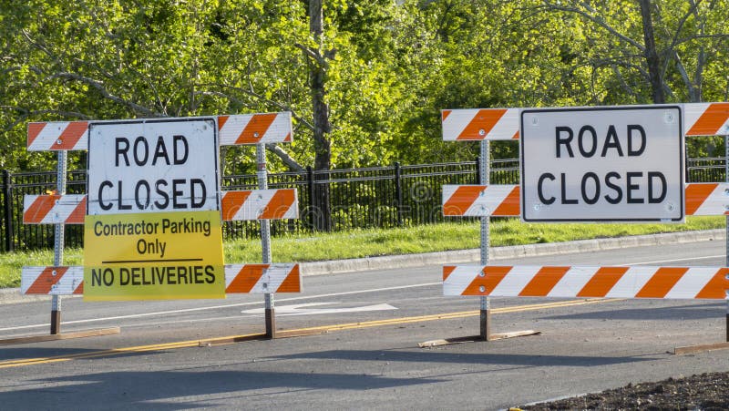 Road Signs Saying "Road Closed" Lined Up on the Side of a Street Stock ...