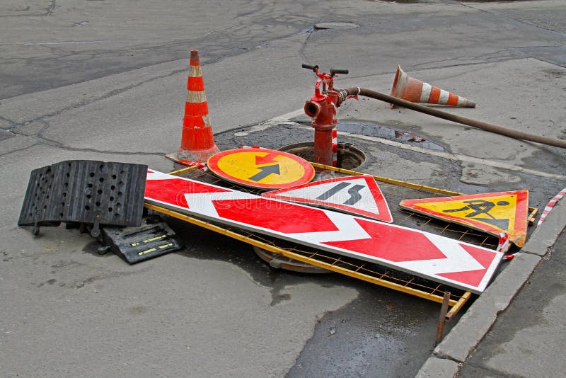 Road Signs, Traffic Cones and Red Fire Hydrant with Hose Stock Image ...