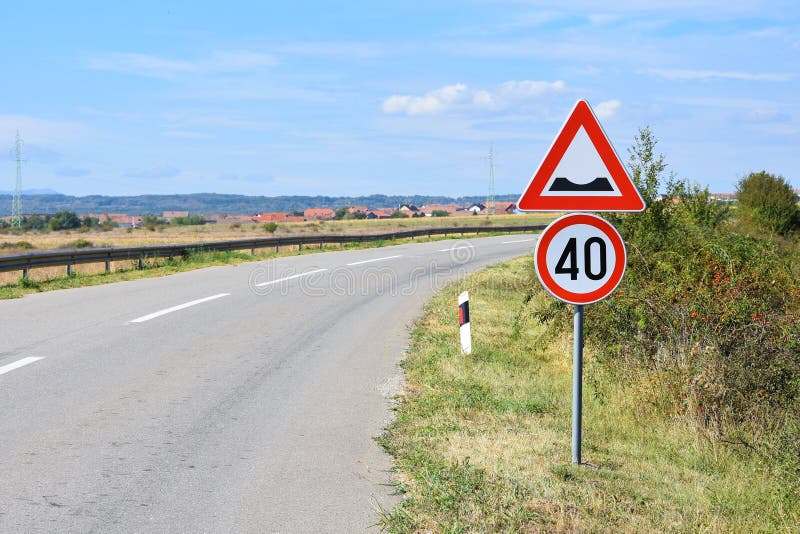 Road Signs that Warn Drivers of Maximum Speed and Dent on the Road ...