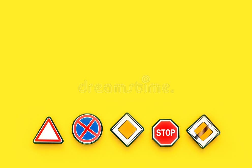 Road Signs on Yellow Background with Copy Space Stock Image - Image of ...