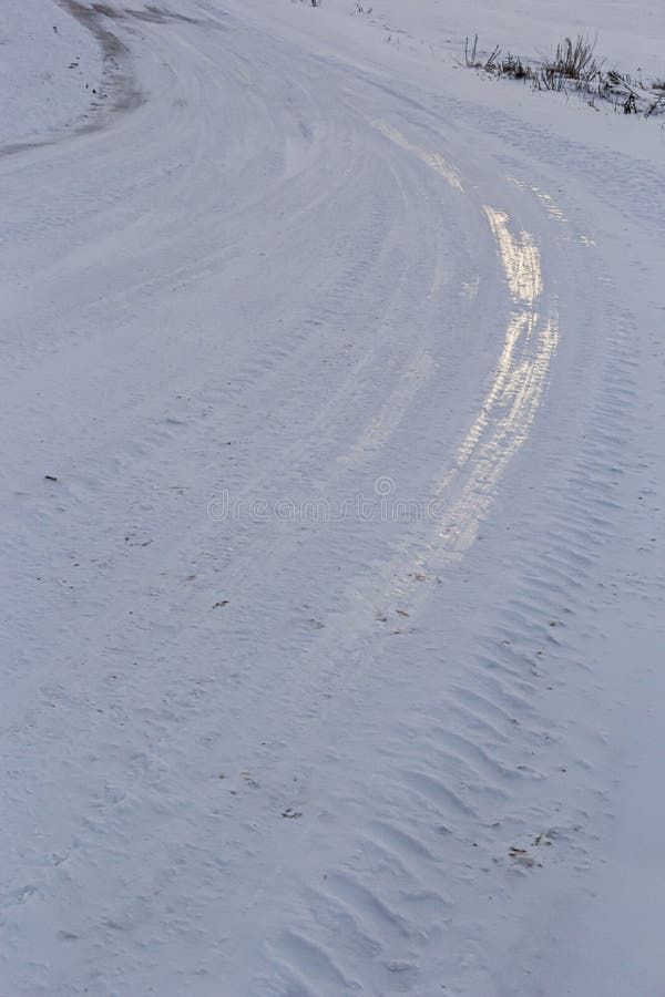A Road through the Snow-covered Country Fields at Sunset. Sunny Winter ...