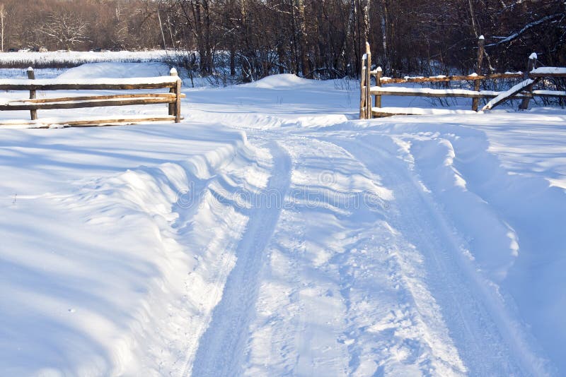 Road in the snow stock photo. Image of village, dirt - 35896558