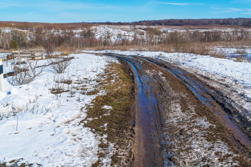 The Road during the Spring Thaw with Mud Stock Photo - Image of field ...