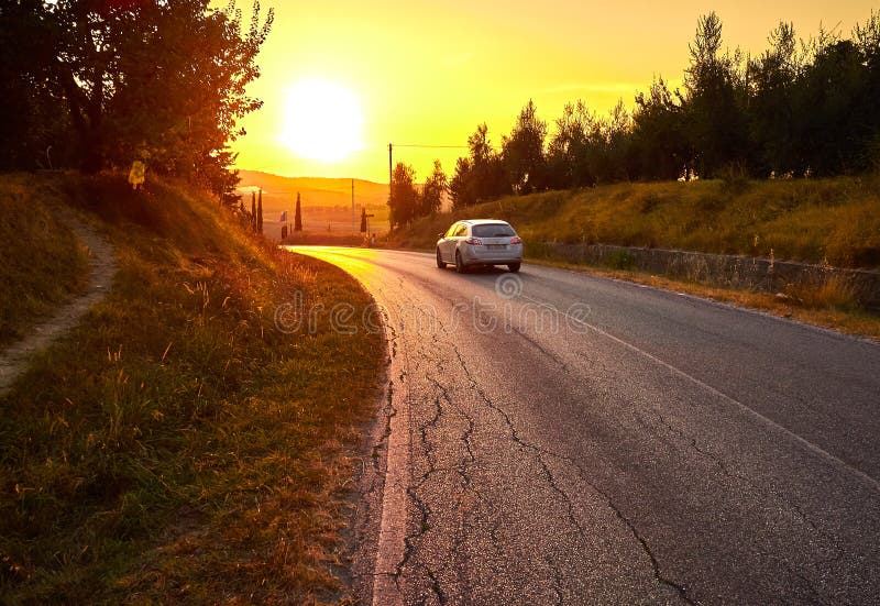 Road at sunset stock image. Image of hills, countryside - 58107615