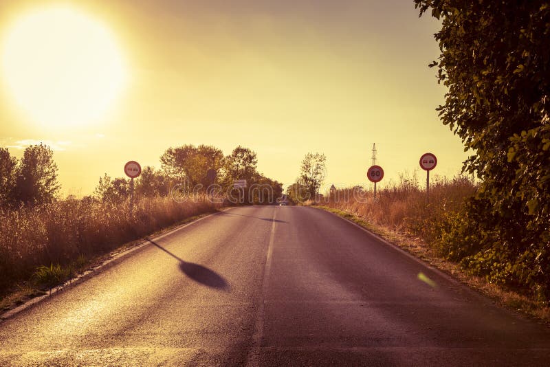 Road at sunset stock image. Image of cars, distance, horizontal - 78170503