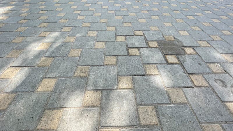 The Road Surface is Made of Natural Stone in the Form of Square Tiles ...