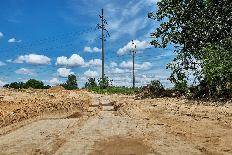 Road To the Construction Site. Rural Road with Power Line Stock Photo ...
