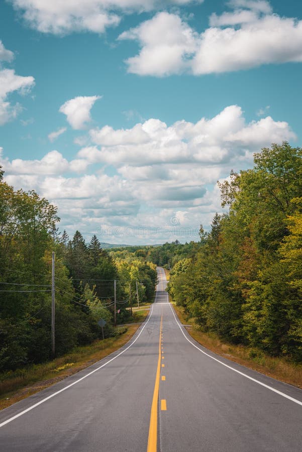 A Road with Trees on the Side, Maine Stock Photo - Image of clouds ...