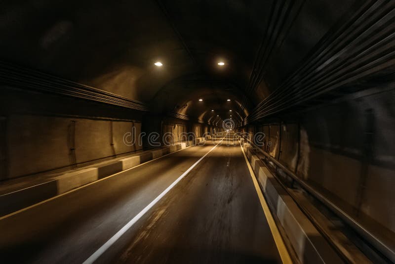 Road Tunnel in Mountain Illuminated by Lamps Stock Photo - Image of ...