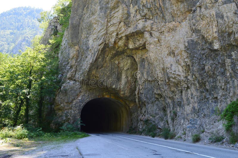 Road tunnel in the rock stock image. Image of geology - 270201335