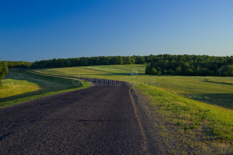 Road turn stock image. Image of bright, trees, lawn, black - 19719057