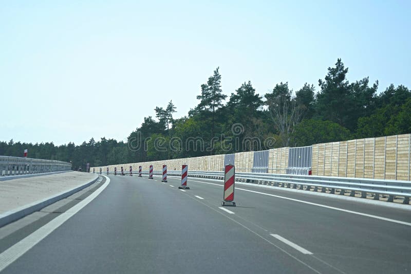 Road Under Construction with Fences Installed, As Well As Newly ...