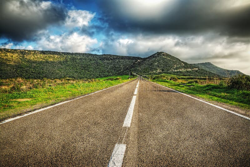 Road Under a Grey Sky Seen from the Centerline Stock Image - Image of ...