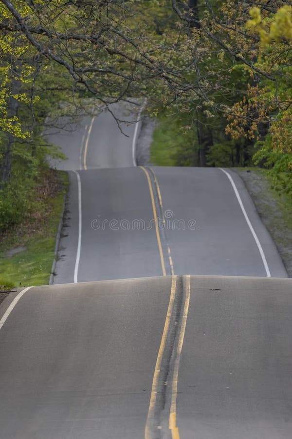 Road with Ups and Downs in Rural Michigan Stock Image - Image of summer ...