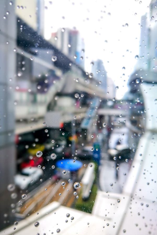 Road View through Mirror of Building Window with Rain Drops. Stock ...