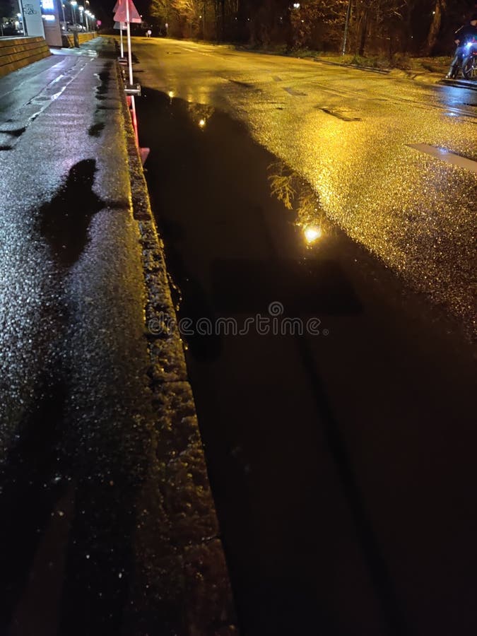 Road and Walking Path Lighting Up in the Night with Rain Stock Image ...