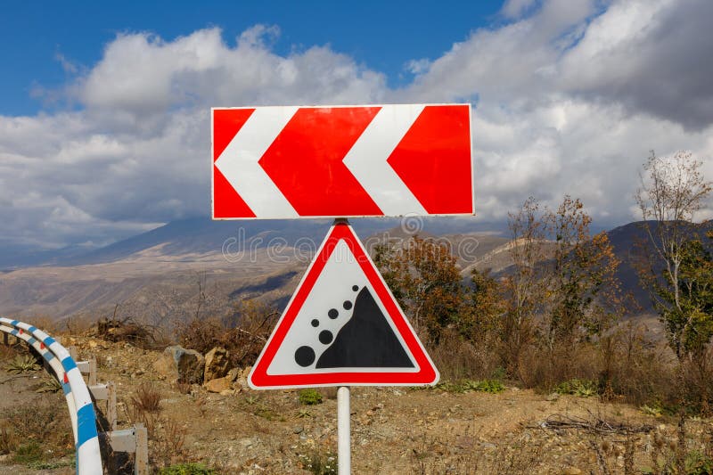 Road Warning Sign Indicating Sharp Turn Ahead in Mountainous Area with ...