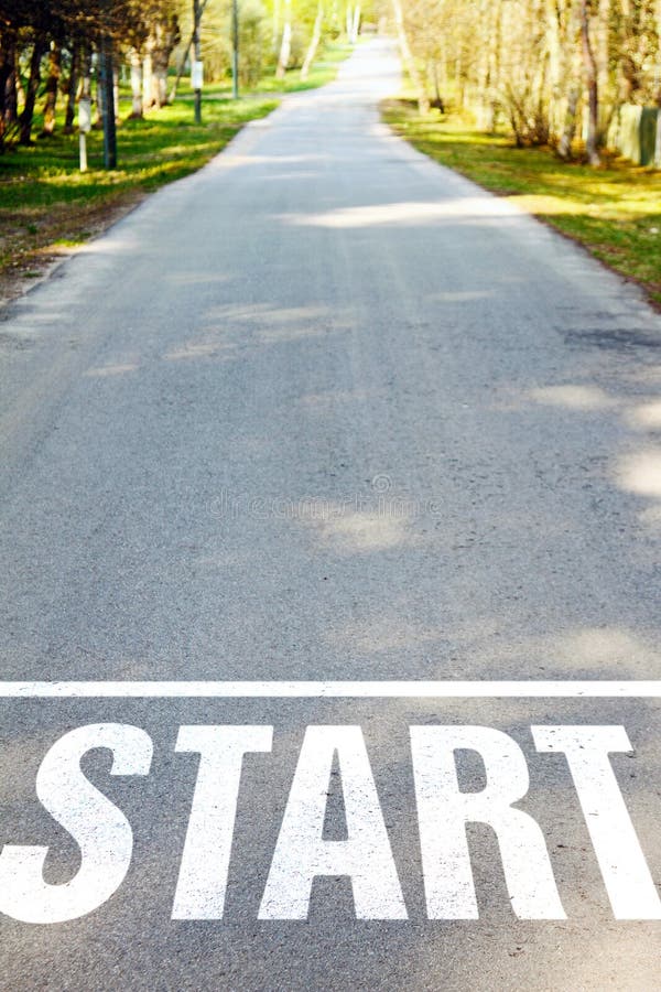 Road with white start sign stock image. Image of arrow - 30962911