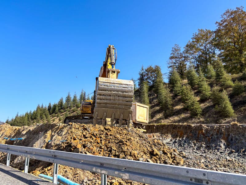 Road Widening Work on the Side of the Highway, Bulldozer and Truck are ...