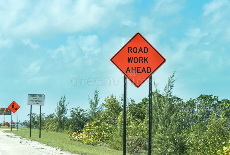 Road Work Ahead Sign on the Edge of the Road Stock Image - Image of ...
