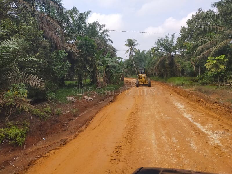 Road work in the village stock photo. Image of motorgrader - 351456014