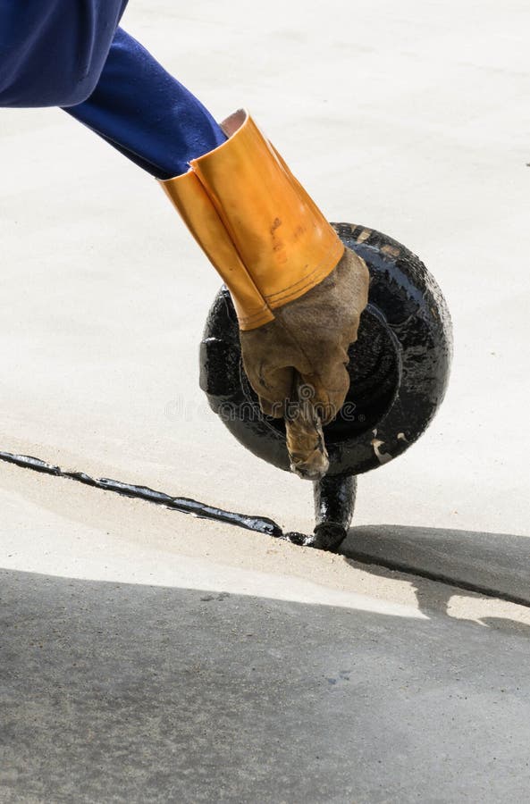 Worker Is Pouring Asphalt For Road Repair Stock Photo - Image of ...