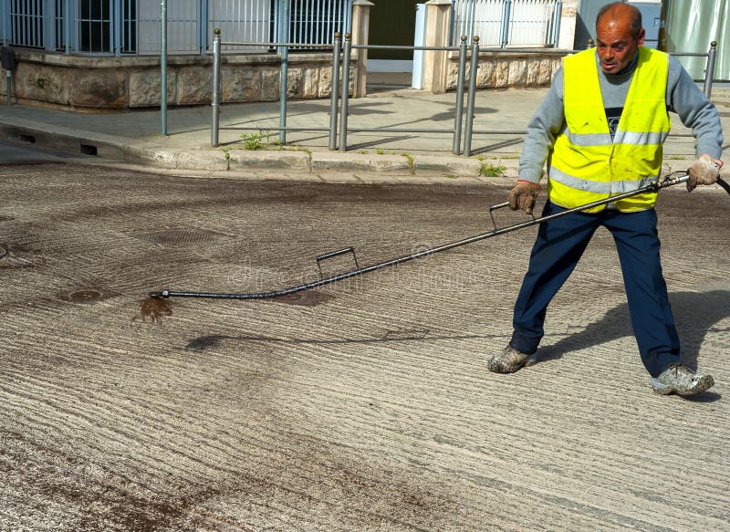 Road Worker Spraying Bitumen Emulsion Stock Photo - Image of ground ...