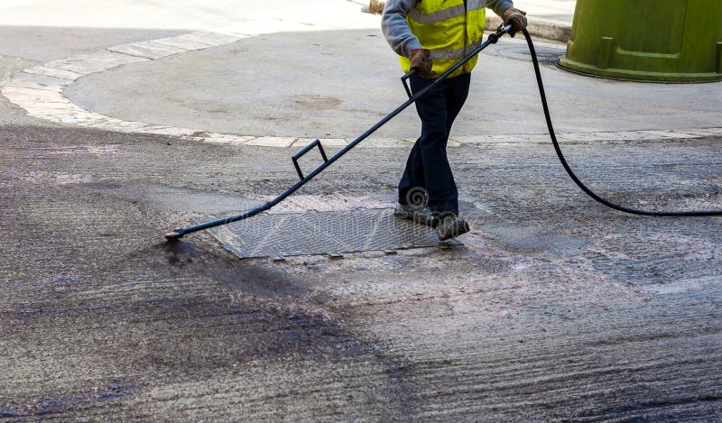 Road Worker Spraying Bitumen Emulsion Stock Image - Image of ...