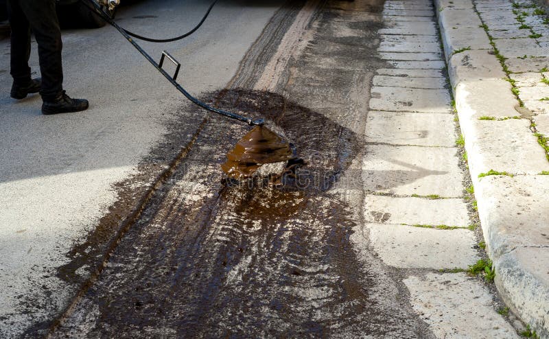 Road Worker Spraying Bitumen Emulsion Stock Photo - Image of dampness ...