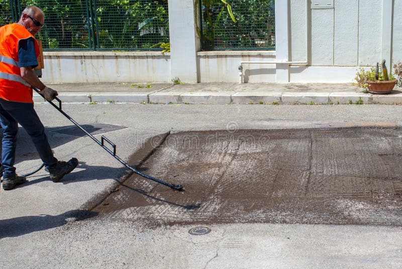 Road Worker Spraying Bitumen Emulsion Stock Photo - Image of garbage ...