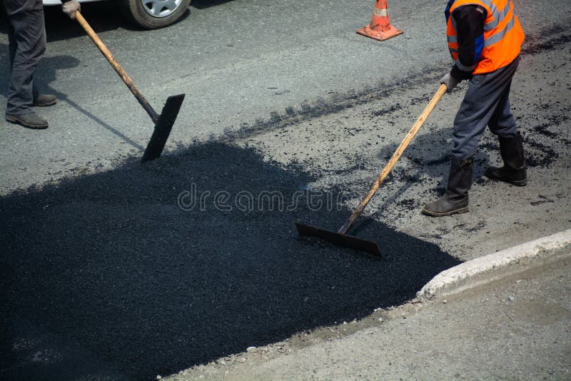 Road workers are paving. stock image. Image of asphalt - 147109193