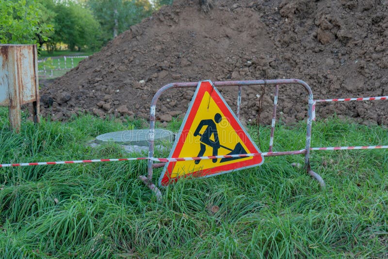 Road Works Sign on the Background of a Pile of Earth Stock Photo ...