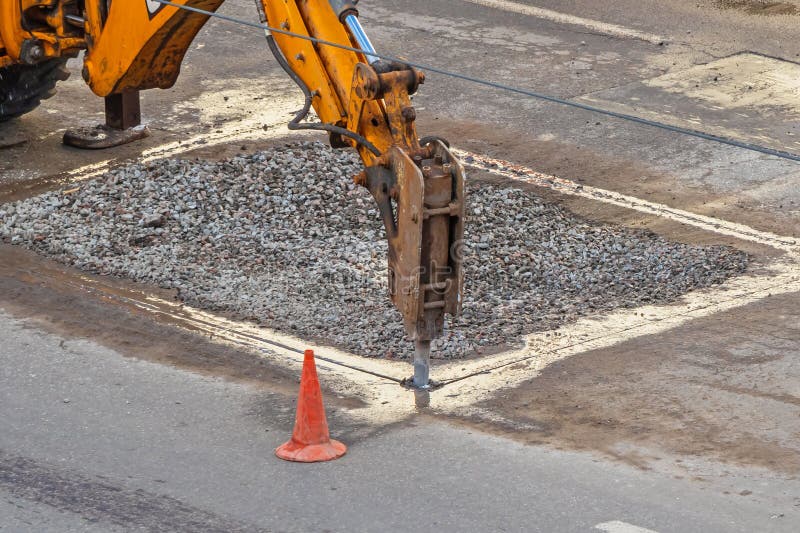 Road Works Using a Hydraulic Hammer. Repair of Asphalt Road Stock Photo ...