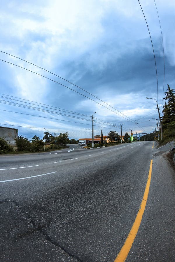 The Road with the Yellow Line and Clouds Stock Photo - Image of closeup ...