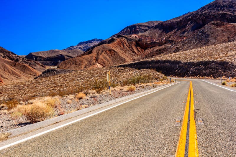 A Road with a Yellow Line Down the Middle Stock Photo - Image of ...