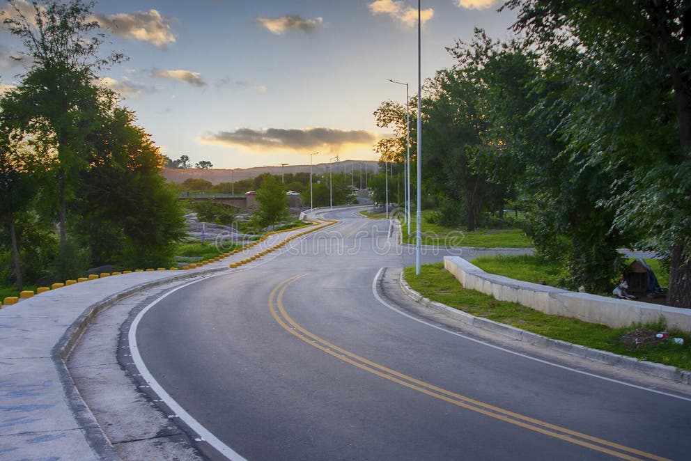 A Road with a Yellow Line Down the Middle Stock Photo - Image of ...