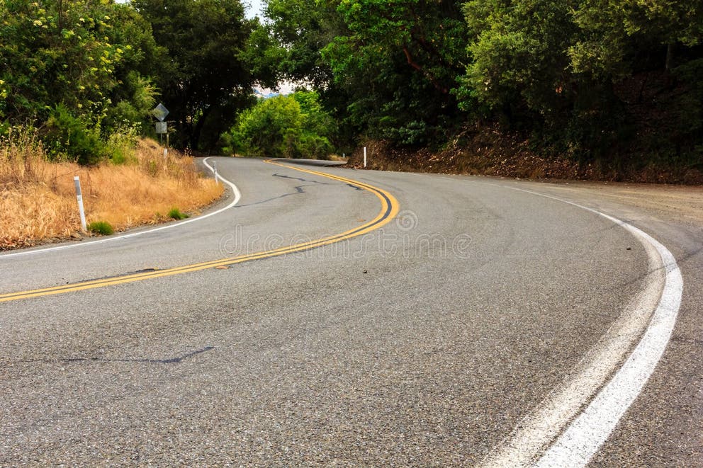 A Road with a Yellow Line Down the Middle Stock Image - Image of ...
