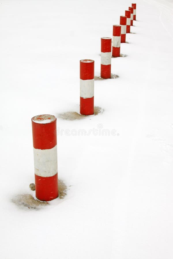 Roadblocks in the snow stock image. Image of pipes, white - 364827263
