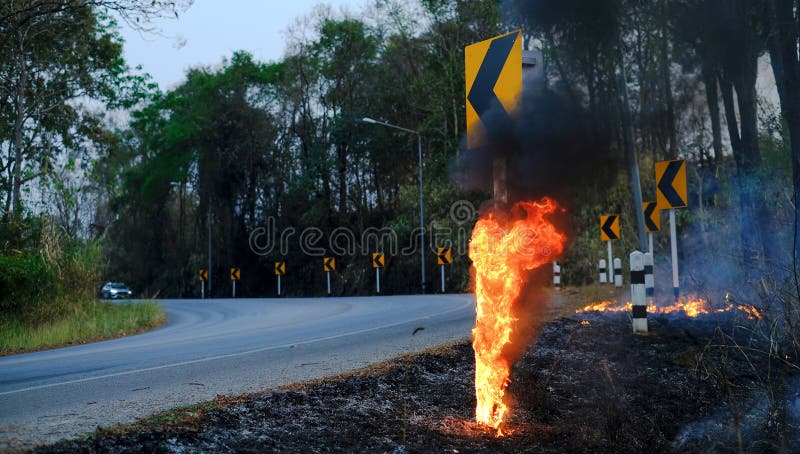 Roadside Pillar Pole is Burning with Flames and There is Smoke Rising ...