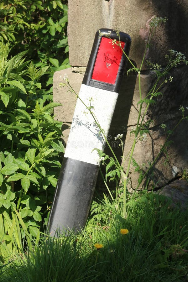 Roadside Reflective Marker Post by End Stone Wall Stock Image - Image ...