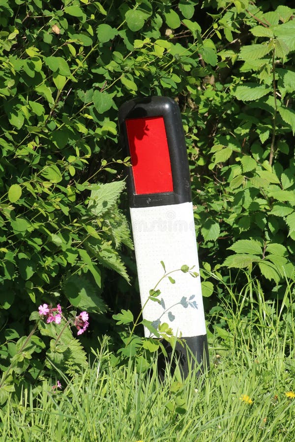 Roadside Reflective Marker Post by Hedge Stock Photo - Image of verge ...
