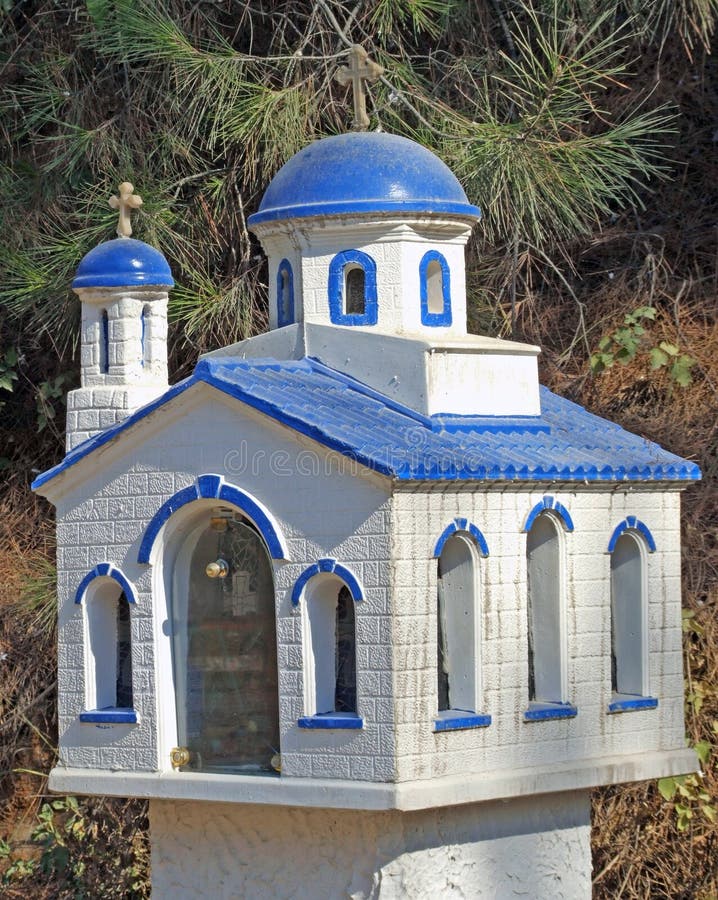 Blue and White Roadside Shrine with Pine Tree Background _ Greece Stock ...