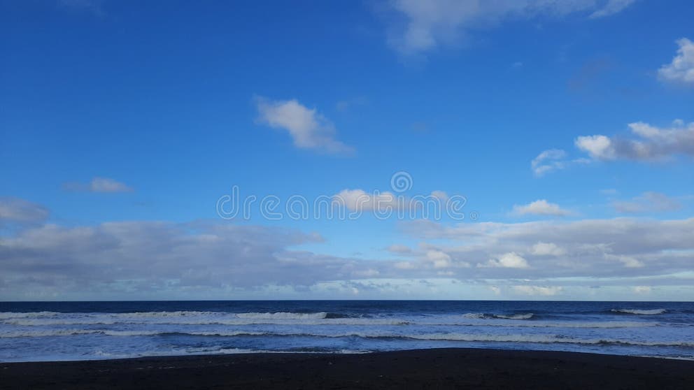 The Roar of the Ocean Waves Side by Side with the Clear Sky Stock Image ...
