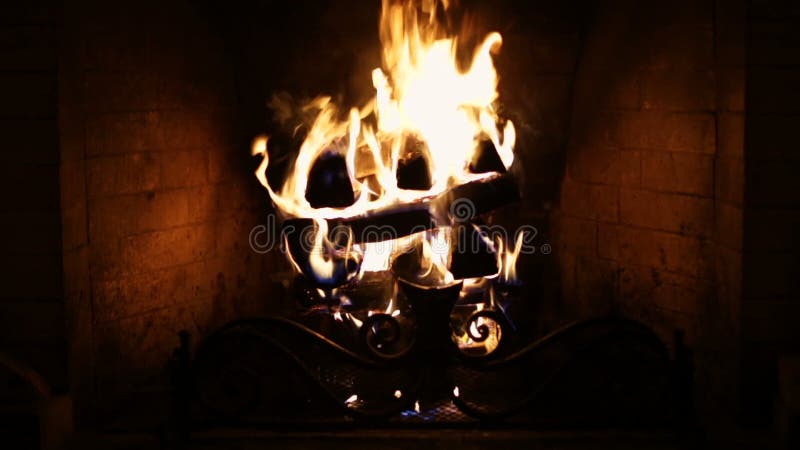 A Roaring Fire within a Large Stone Arched Fireplace. Stock Footage ...