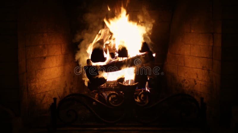 A Roaring Fire within a Large Stone Arched Fireplace. Stock Video ...