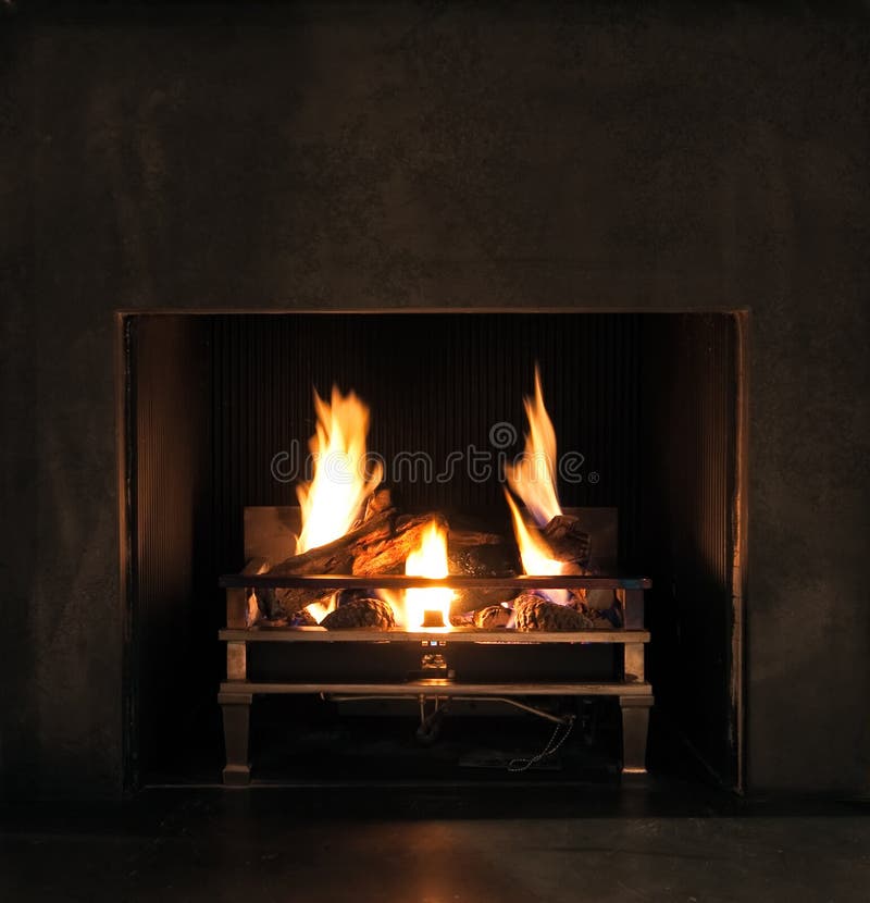 Stone Fireplace with a Lit Roaring Fire Stock Image - Image of blaze ...