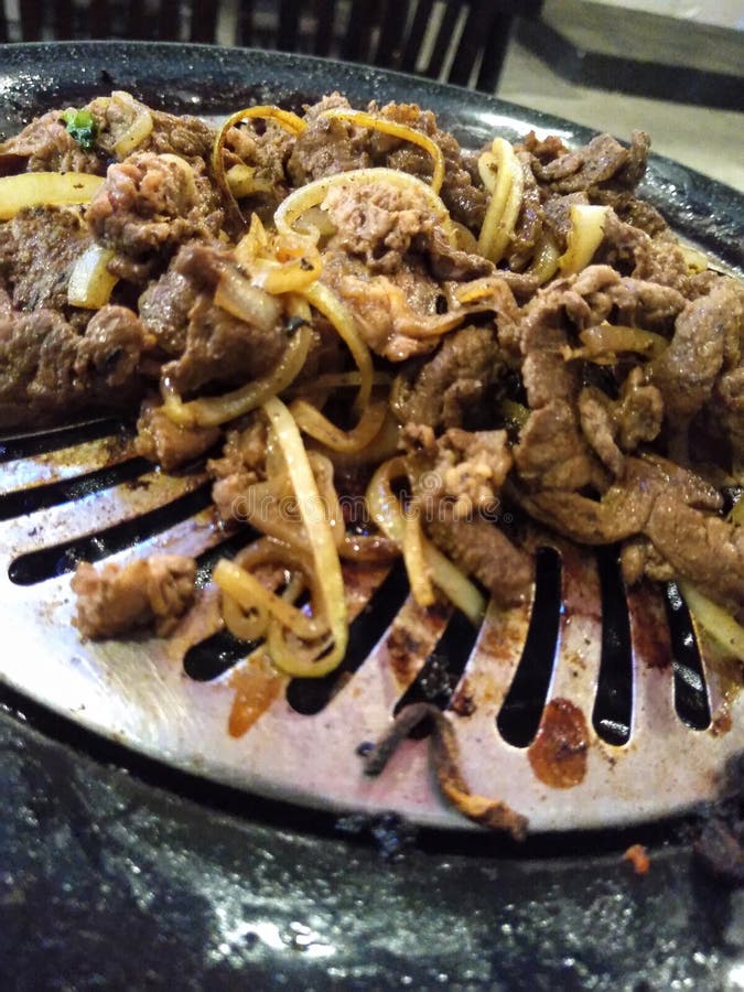 Roast Beef until Cooked by Adding Onions To Make it Taste Better Stock ...